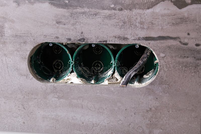 Three Electrical Boxes for Conduits are Built into the Wall. Work on ...