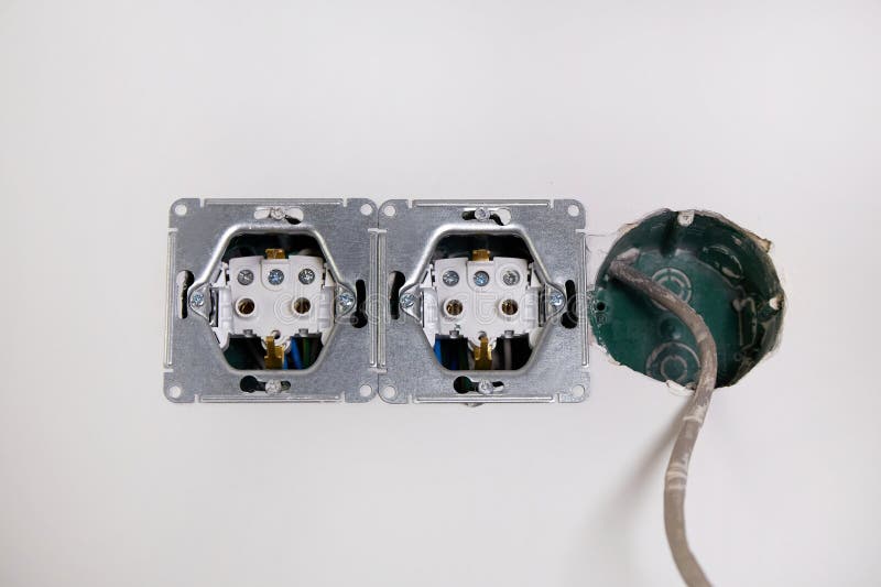 Three Electrical Boxes for Conduits are Built into the Wall. Work on ...