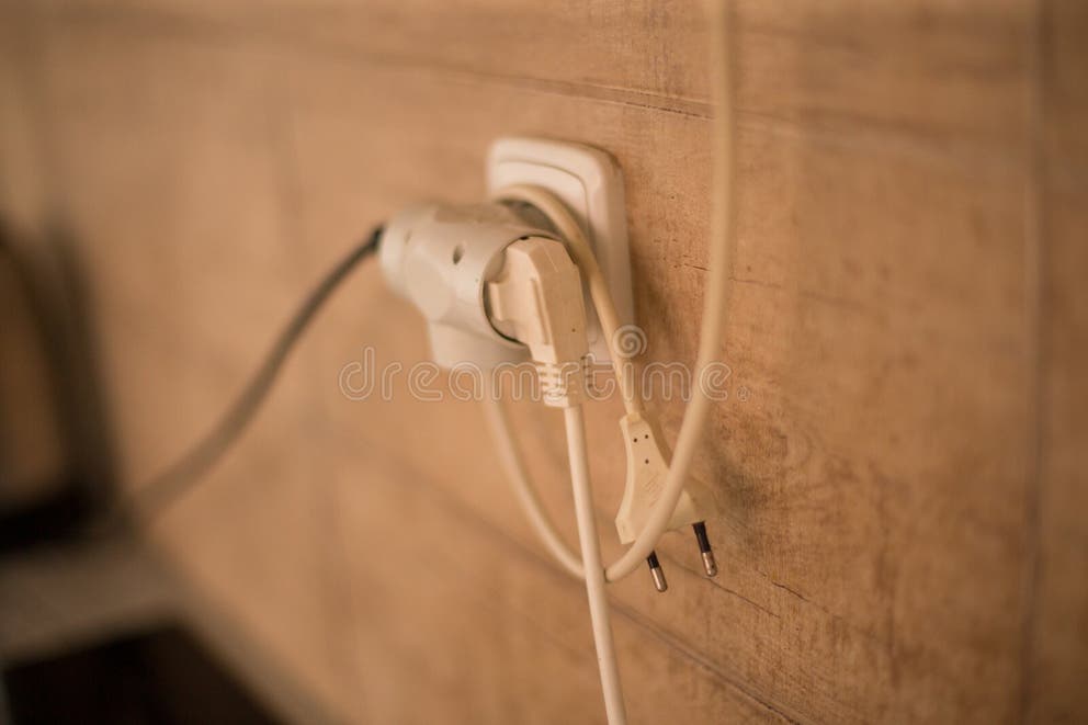 Electrical Outlet with Multiple Cords Against Wooden Background Stock ...