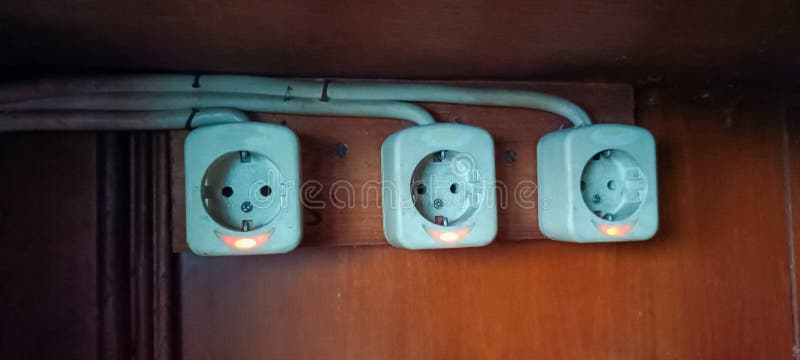 Three Electrical Outlets Under the Table Stock Photo - Image of table ...