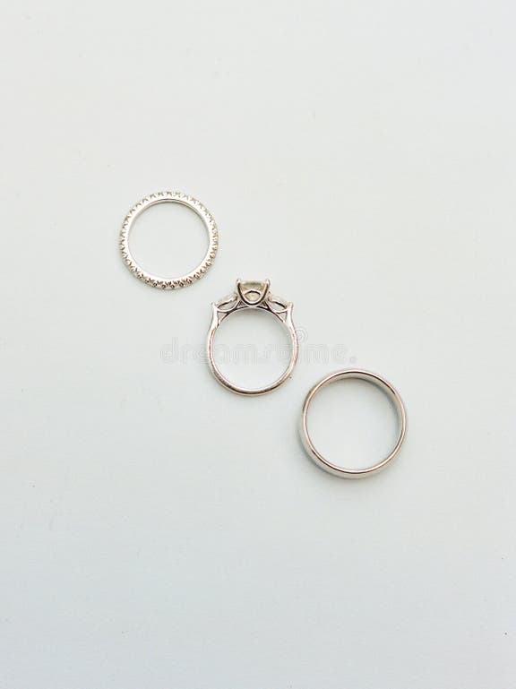 Three Elegant Silver Rings Displayed on a White Surface Highlighting ...