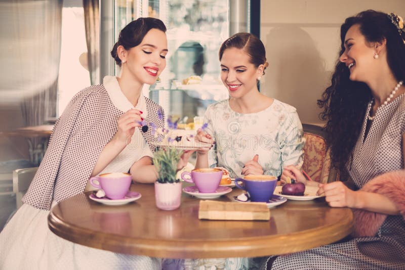 Three Elegant Young Ladies in a Cafe Stock Photo - Image of dinner ...