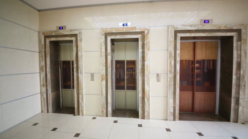 Three Elevator Doors in Corridor of Residential Stock Video - Video of ...