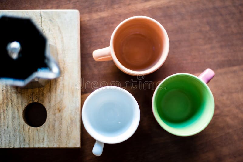 Three Empty Cups Near a Moka Full of Coffee Stock Image - Image of ...