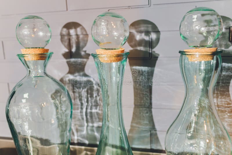 Three Empty Glass Bottles Standing in a Row. Stock Image - Image of ...