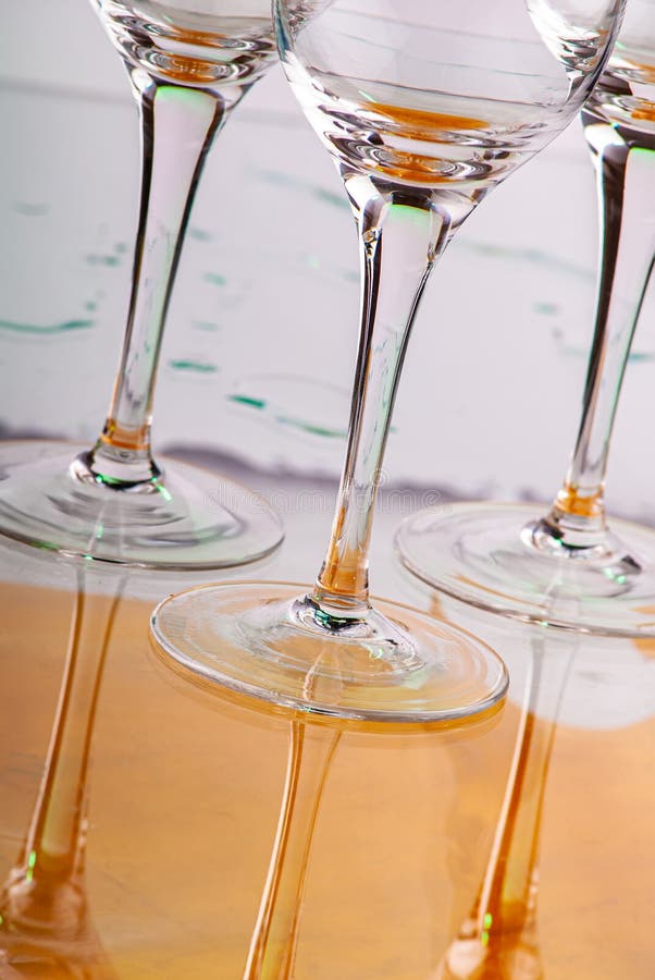Three Empty Glass Champagne Glasses on a Glass Surface Stock Photo ...