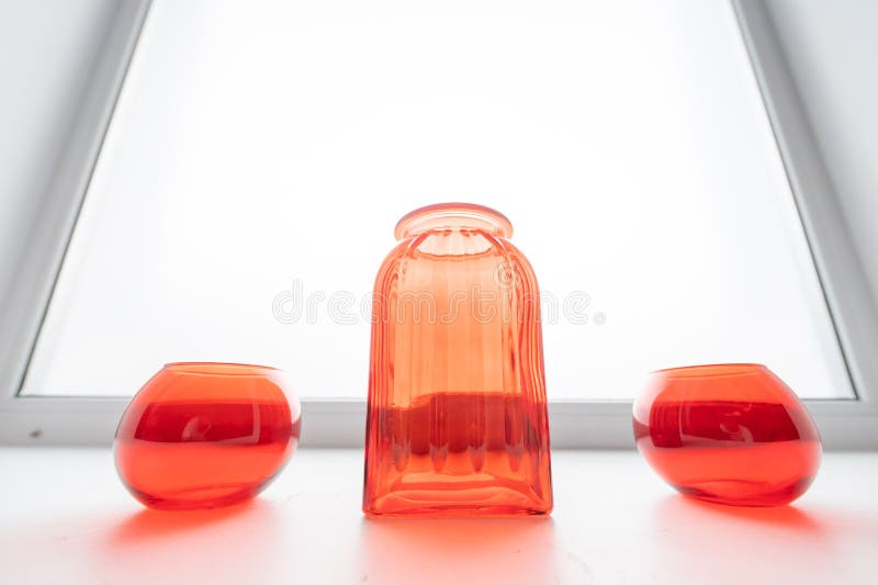 Three Empty Glass Red Vases on the Windowsill. Stock Photo - Image of ...