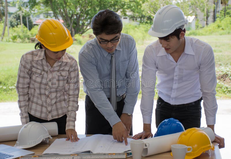 Three Engineer Teams I& X27;m Talking about Construction. Stock Image ...
