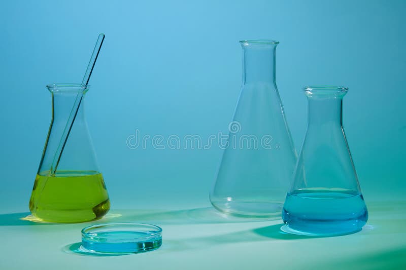 Three Erlenmeyer Flask Filled with Blue and Yellow Fluid Stock Image ...