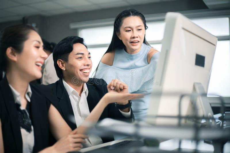 Three Excited Employees Reading Good News on Line in a Computer Desktop ...