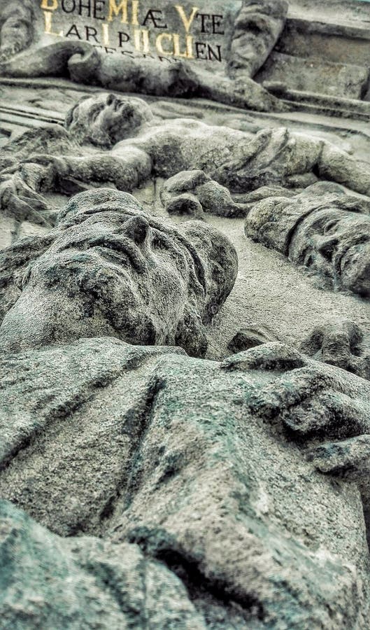 Three faces in statue stock image. Image of czechrepublic - 95271055