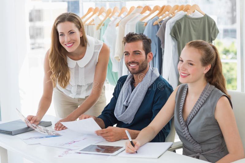 Three Fashion Designers Discussing Designs Stock Image - Image of ...