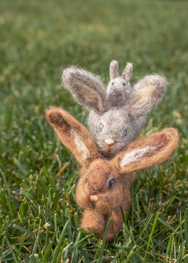 Three Felted Bunnies or Rabbits in Vertical Stack on Green Grass Stock ...