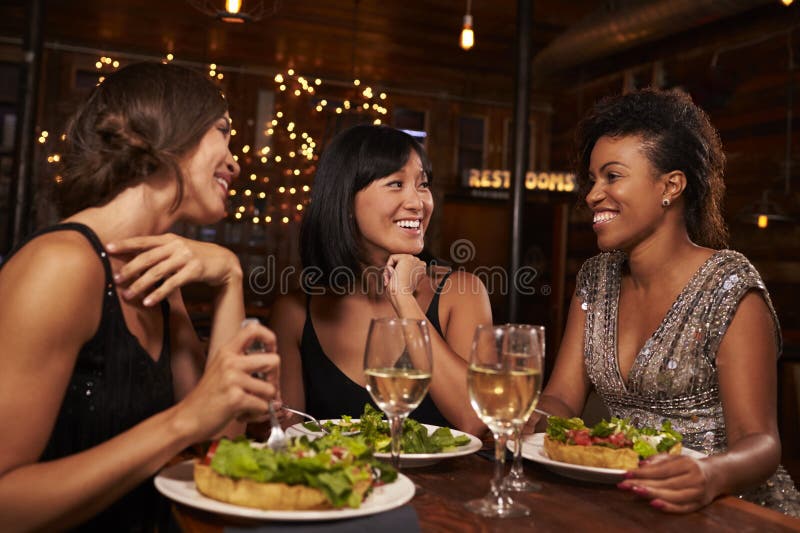 Friends Eating At Restaurant