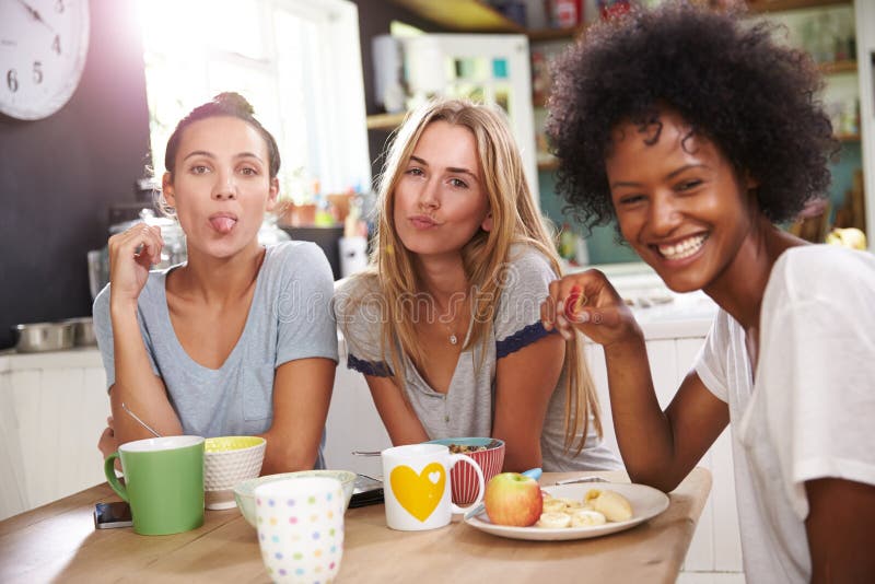 Three Female Friends Enjoying Breakfast at Home Together Stock Photo ...