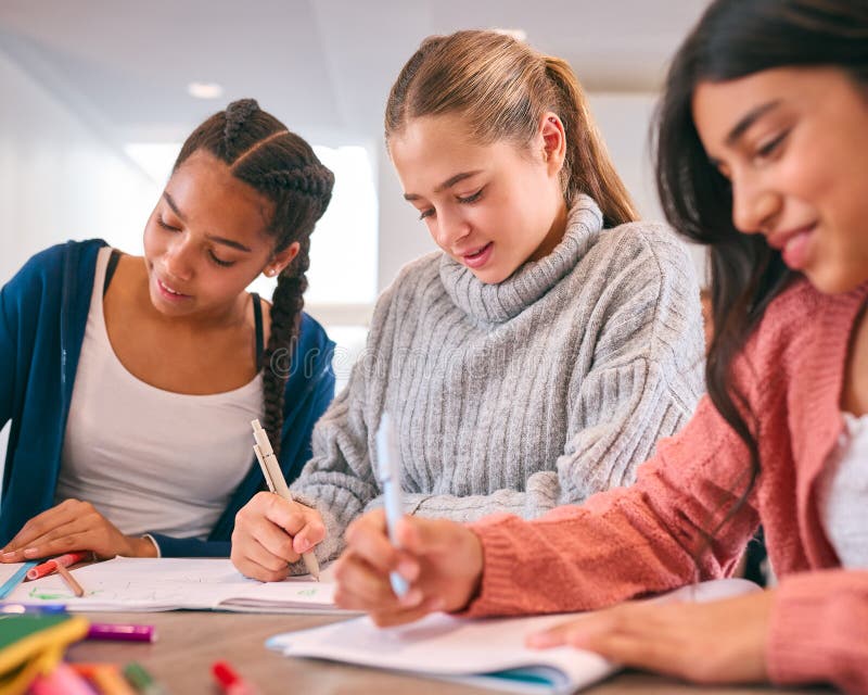 Three Female Secondary or High School Students Collaborating in Study ...
