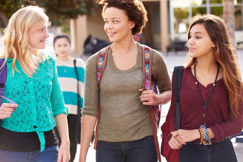 Three Female Students Walking To High School Stock Image - Image of ...