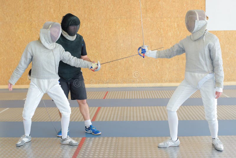 Three fencers on practice stock photo. Image of plastron - 87671404