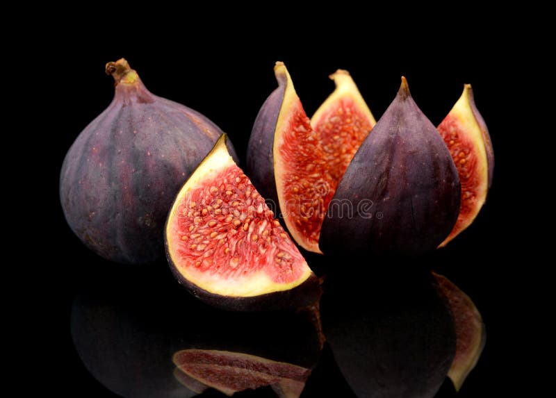 Three Figs Split Like Flower on Black Background Stock Image - Image of ...