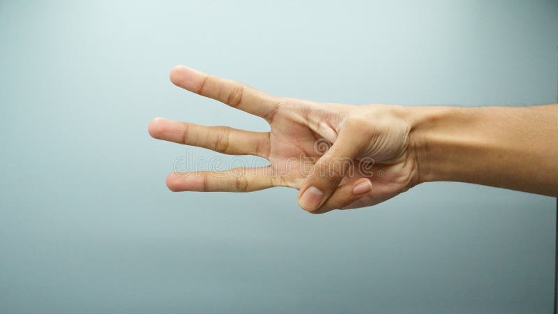 Three Fingers Shows in Hand Image Stock Photo - Image of design, brand ...