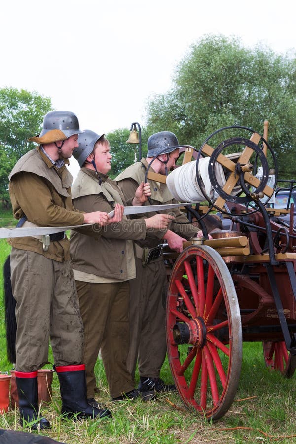 Three Fireman Operating Traditional Fire Engine Editorial Photography ...