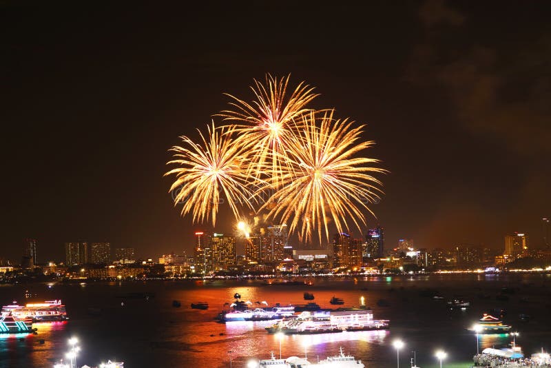 Three Fireworks on Beach and Reflection Color on Water Surface of Light ...