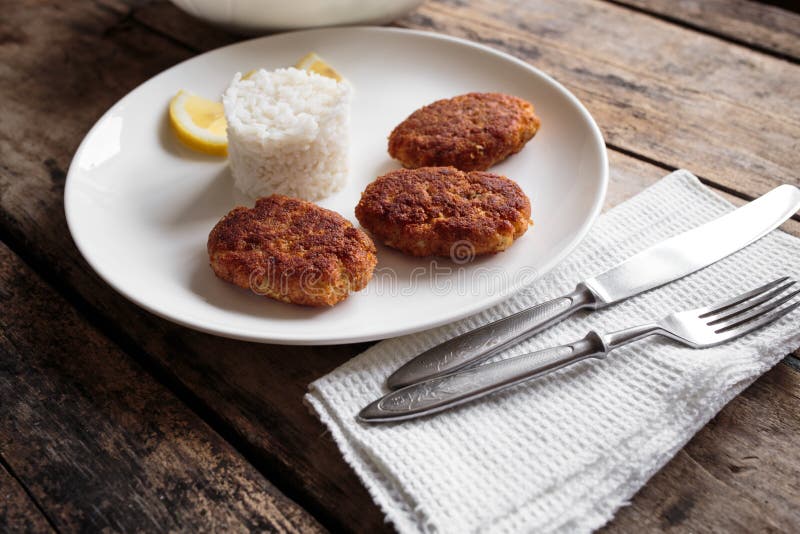 Three Fish Cutlet on White Plate with Rice Stock Photo - Image of ...