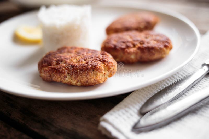 Three Fish Cutlet on White Plate with Rice Stock Photo - Image of ...