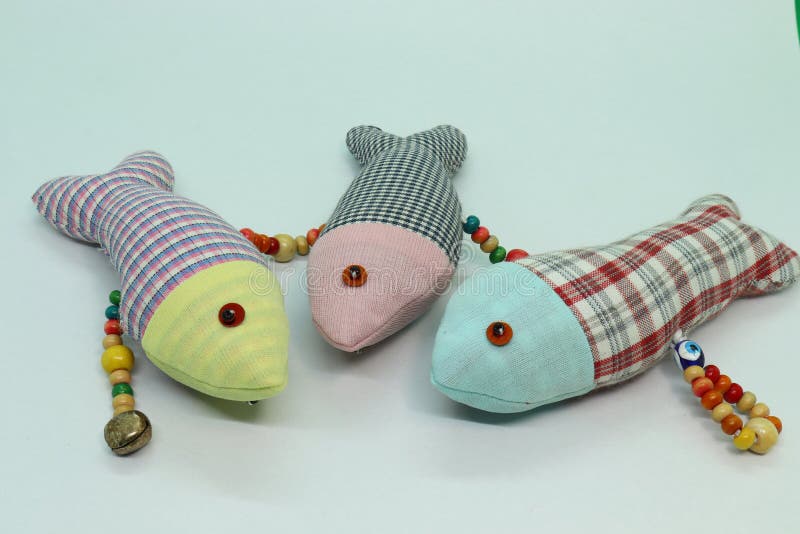 Three Fish Figures Sewn from Various Fabrics Stand Side by Side. Stock ...