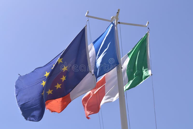 Three flags on the border stock photo. Image of flagstaff - 33778890