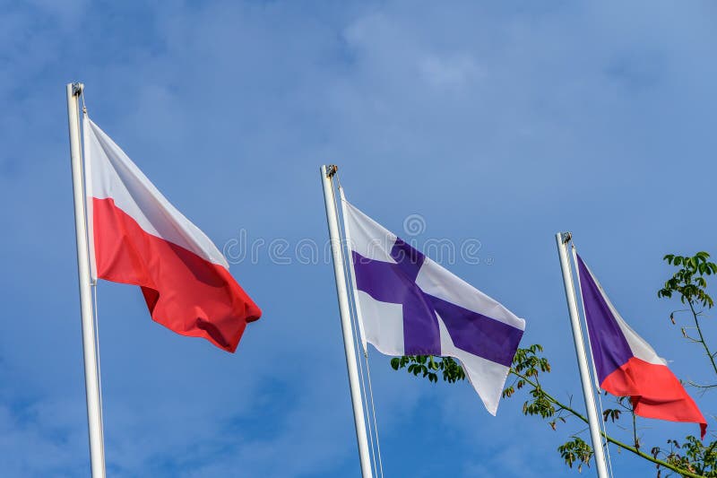Three Flags Waving Against a Bright Blue Sky, Symbolizing Unity and ...
