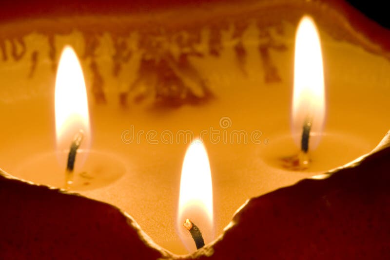 Three flames stock photo. Image of macro, candlelight - 7394064