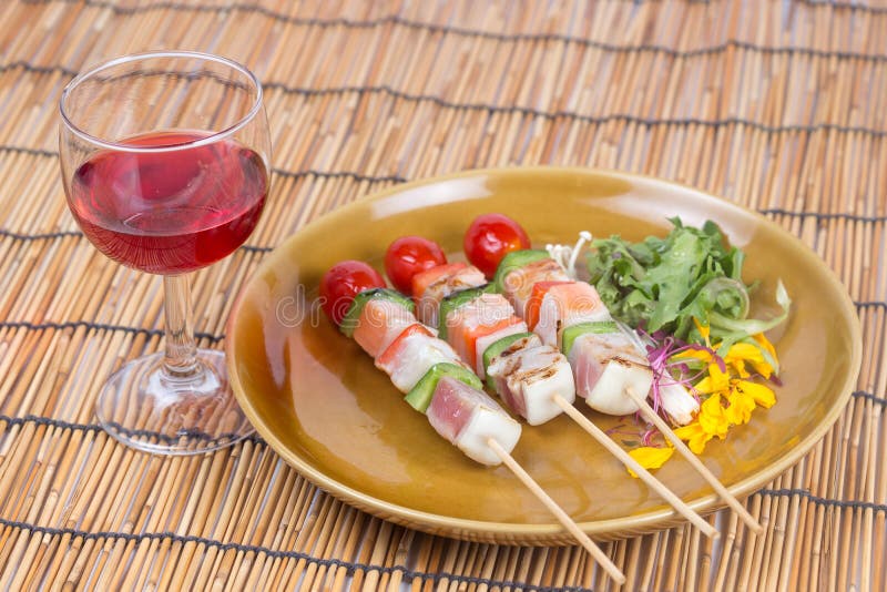 Three Flavored Fish Barbeque and Red Wine Stock Photo - Image of mixed ...