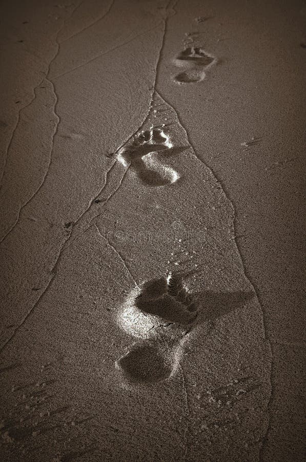 Three Footprints in Sand on Beach Stock Image - Image of foot, leisure ...