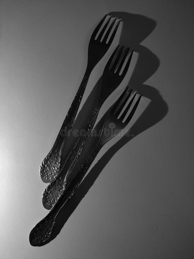 Three Forks with Shadows on the White Ground Stock Photo - Image of ...