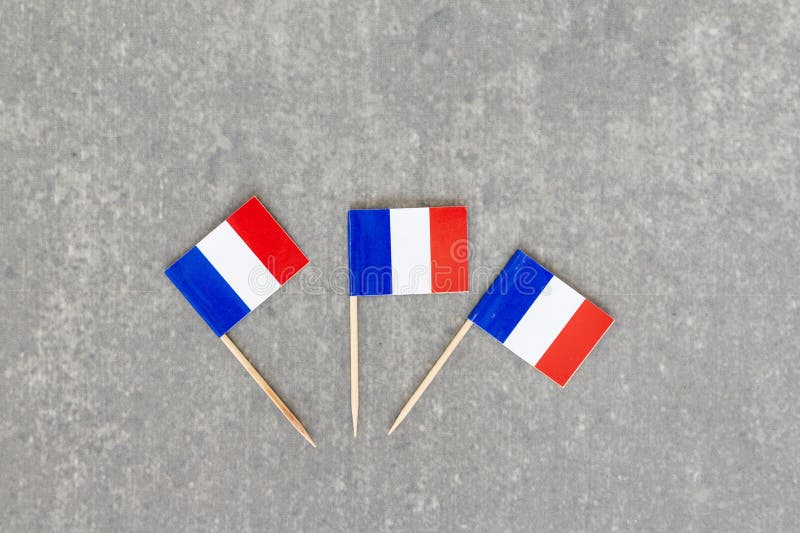 Three French Mini Flags on Gray Background Stock Image - Image of ...