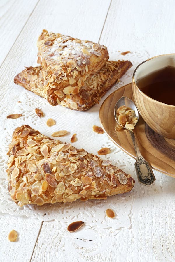 Three French Puff with Ground Almonds and a Cup of Black Tea Stock ...