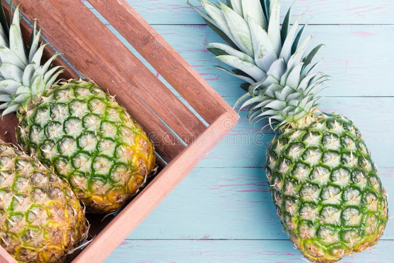 Three Fresh Pineapples, Two in a Wooden Crate Stock Image - Image of ...