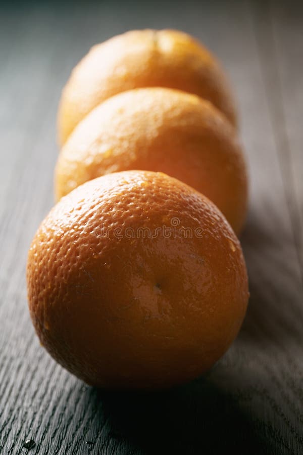 Three Fresh Ripe Oranges on Oak Wooden Table Stock Photo - Image of ...