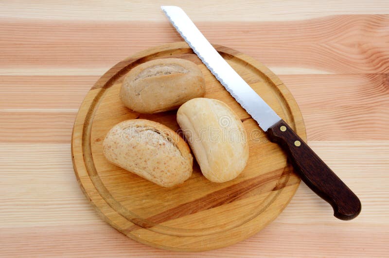 Fresh Rolls, Whole and Halved, with Bread Knife Stock Image - Image of ...
