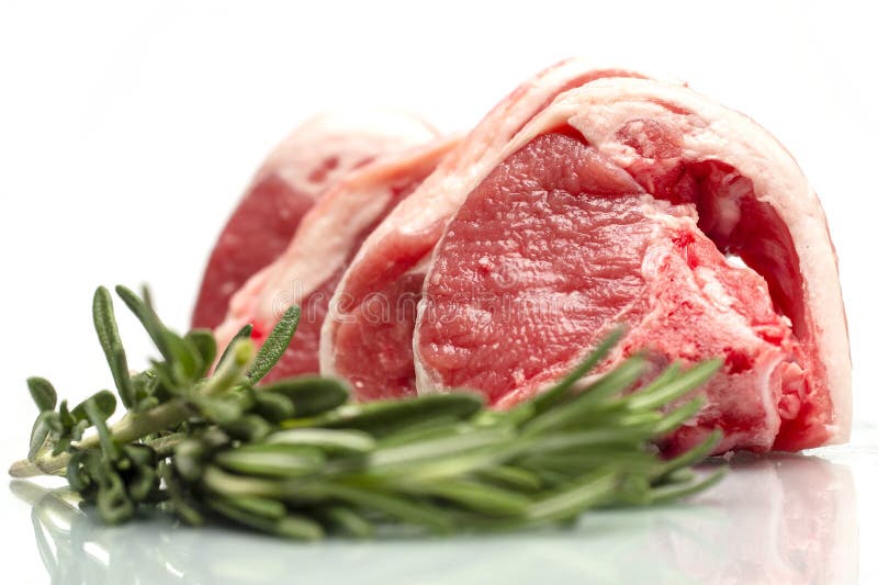 Three Fresh Uncooked Lamb Chops with Bone in on a White Isolated ...