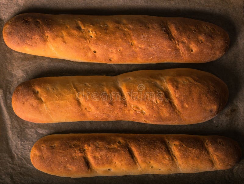 Three Freshly Made Loaves of Bread Stock Photo - Image of food, concept ...