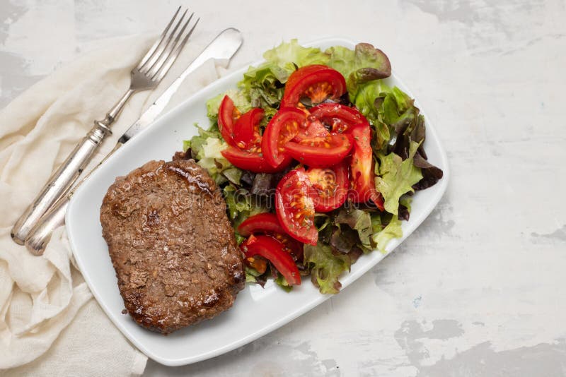 Three Fried Ground Meat with Fresh Salad on White Plate Stock Image ...