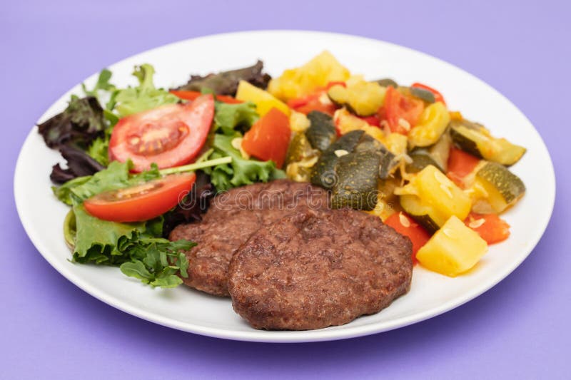 Three Fried Ground Meat with Vegetables and Fresh Salad on White Plate ...