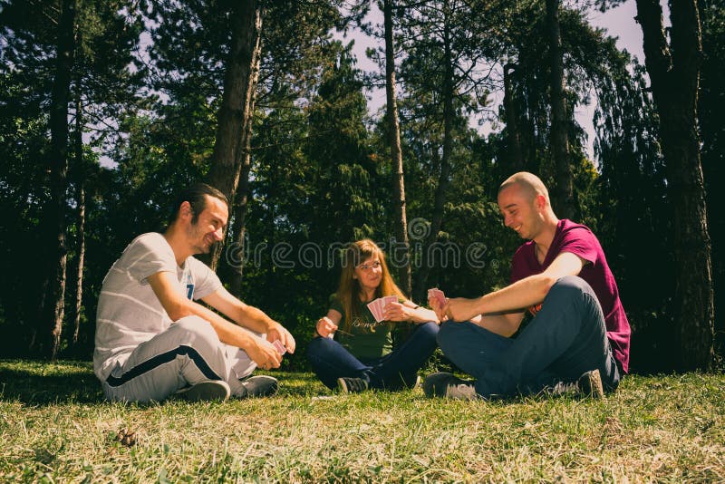 Three friends having fun stock photo. Image of forest - 57665942