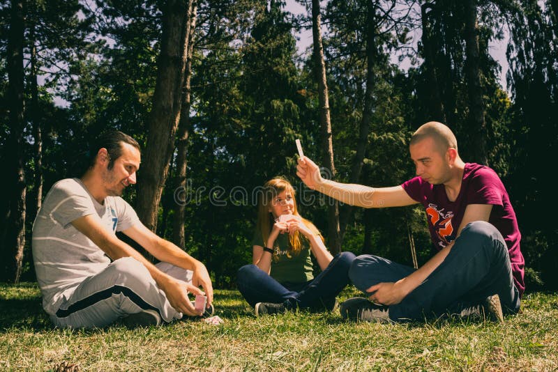 Three friends having fun stock photo. Image of forest - 57665942