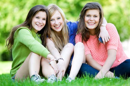 Three friends stock photo. Image of outdoors, sitting - 20954146