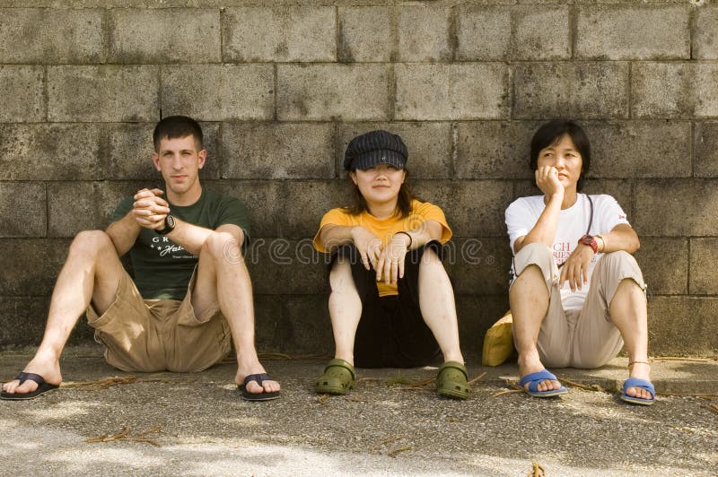 Three friends stock photo. Image of wall, women, sitting - 2800316