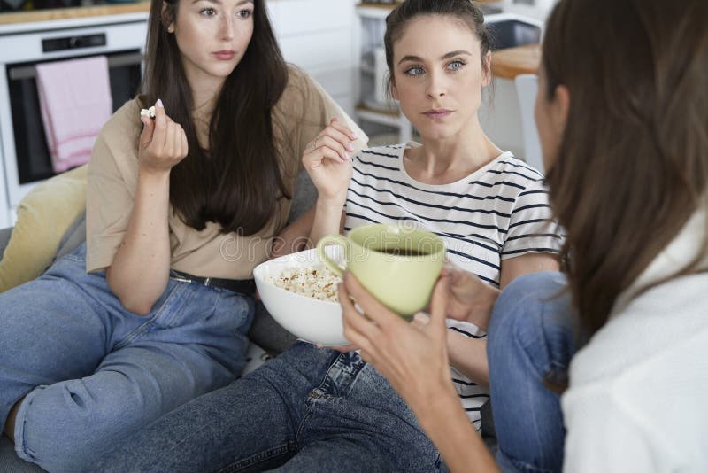Three Friends Chatting and Eating Popcorn Stock Image - Image of ...