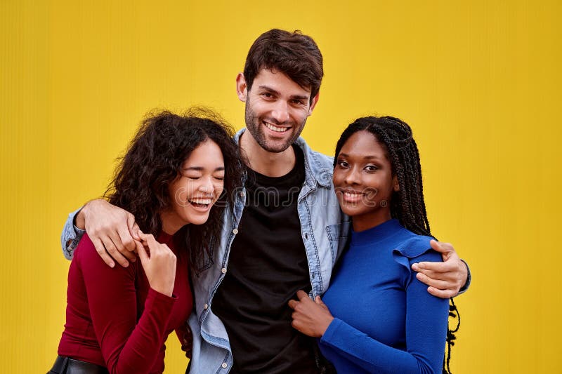Three Friends Embracing and Smiling while Posing Together. Stock Image ...